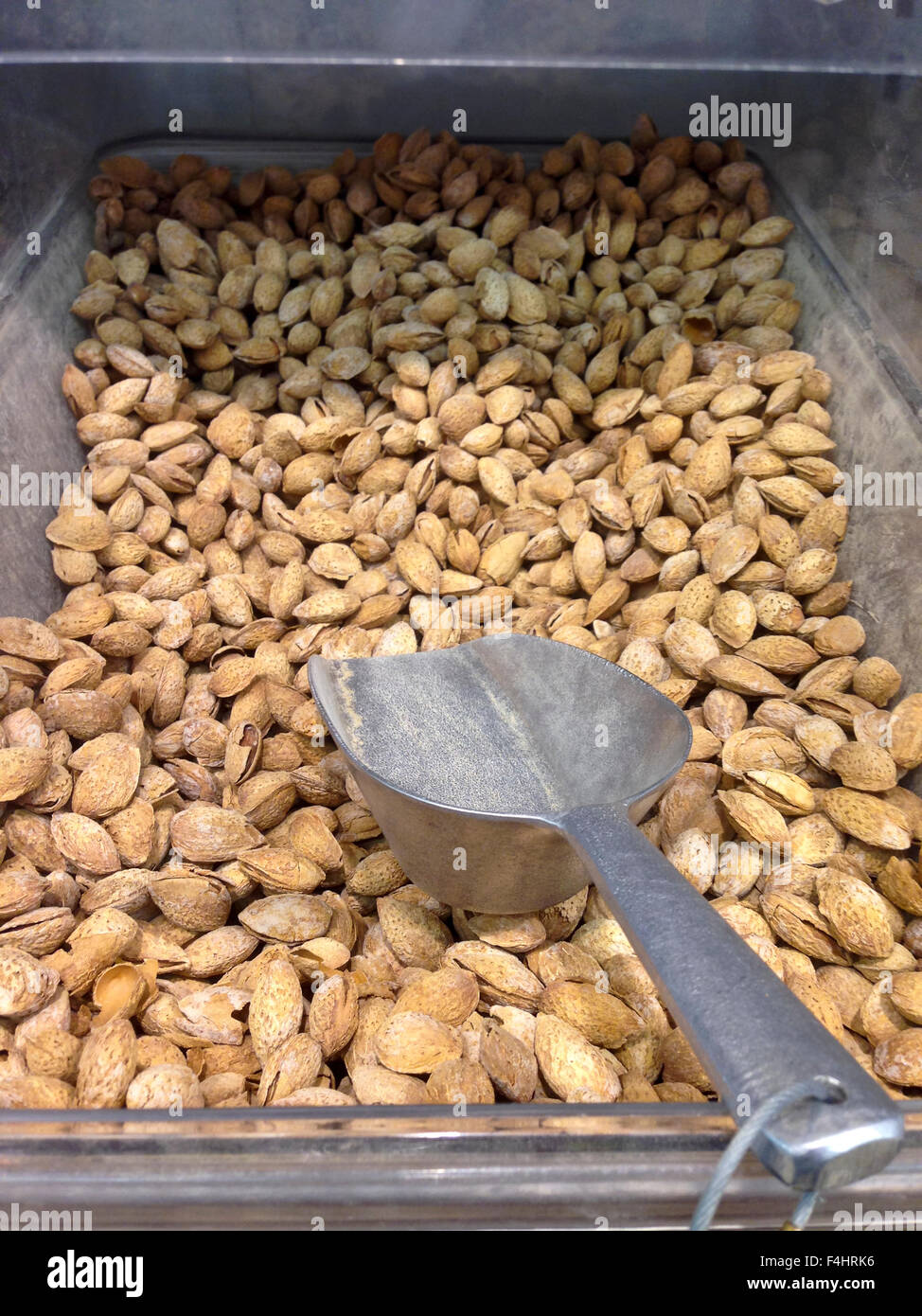 Box with almonds on market with shovel for serve yourself Stock Photo ...