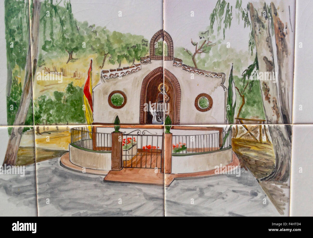 GUARO, SPAIN, JULY 7, 2015: Colorful glazed tiles wall that recreates ...