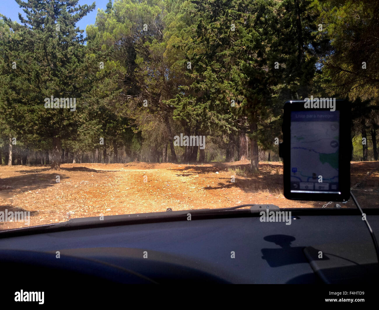 Driving with satelite navigation/GPS device by rural area roads, Spain ...