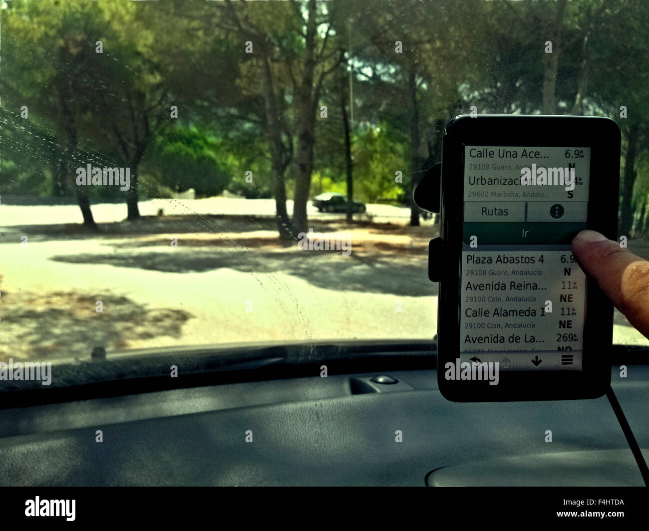 Man choosing his destination and pressing go before begining his ...
