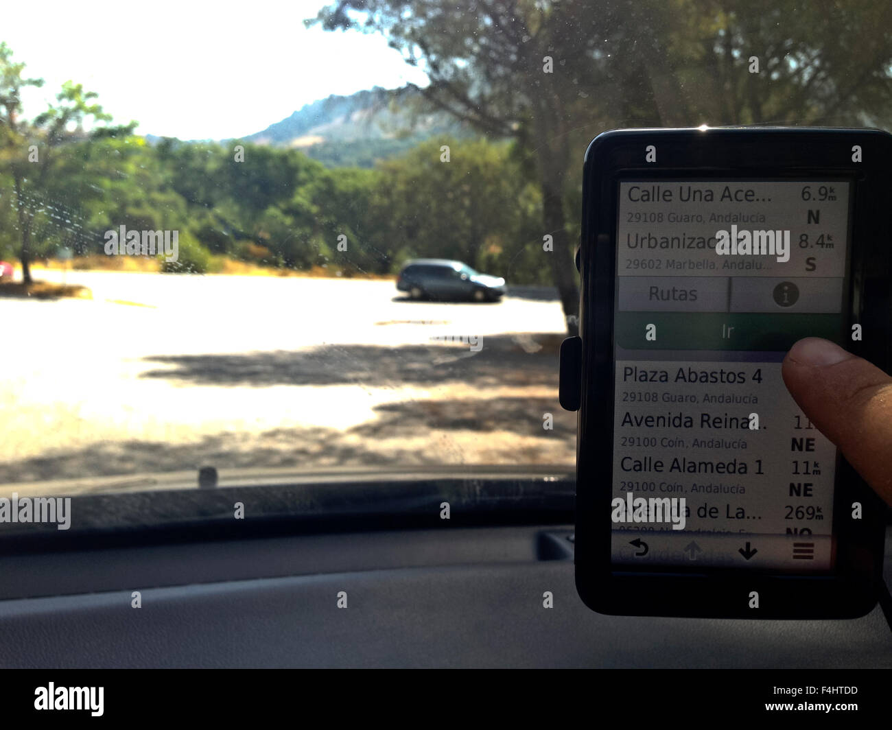 Man choosing his destination and pressing go before begining his ...