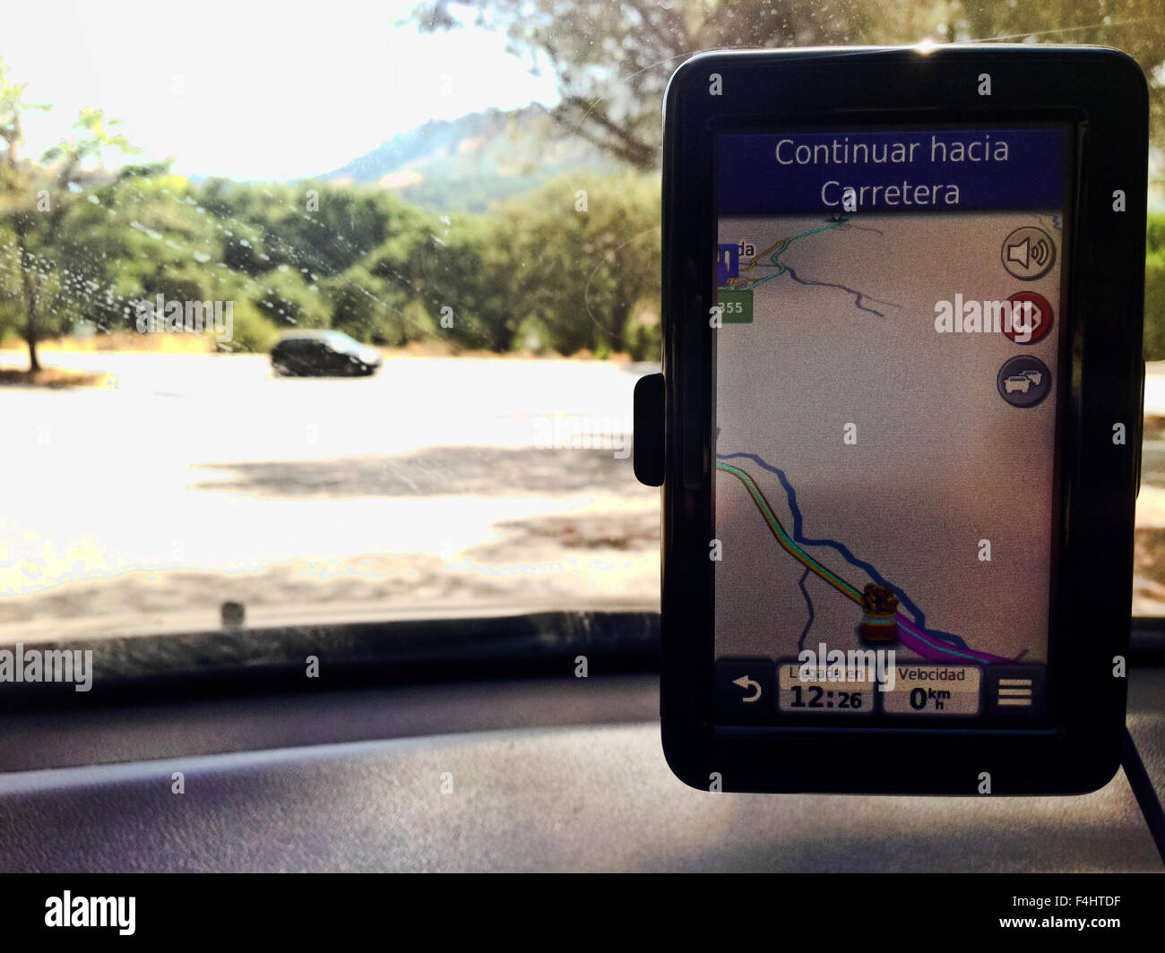 Driving with satelite navigation/GPS device by rural area roads, Spain ...