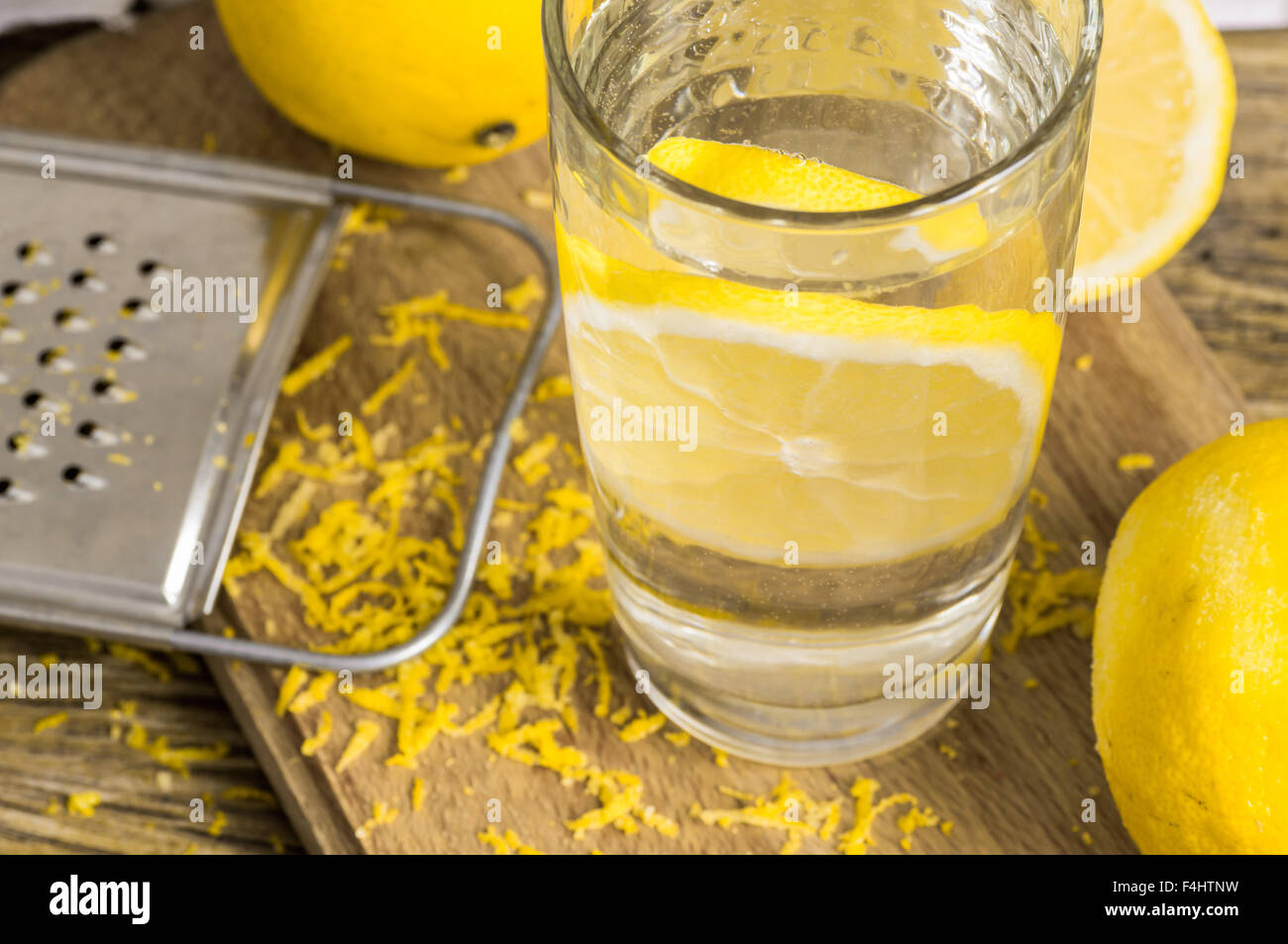 Glass of water lemon, zest and lemon Stock Photo - Alamy