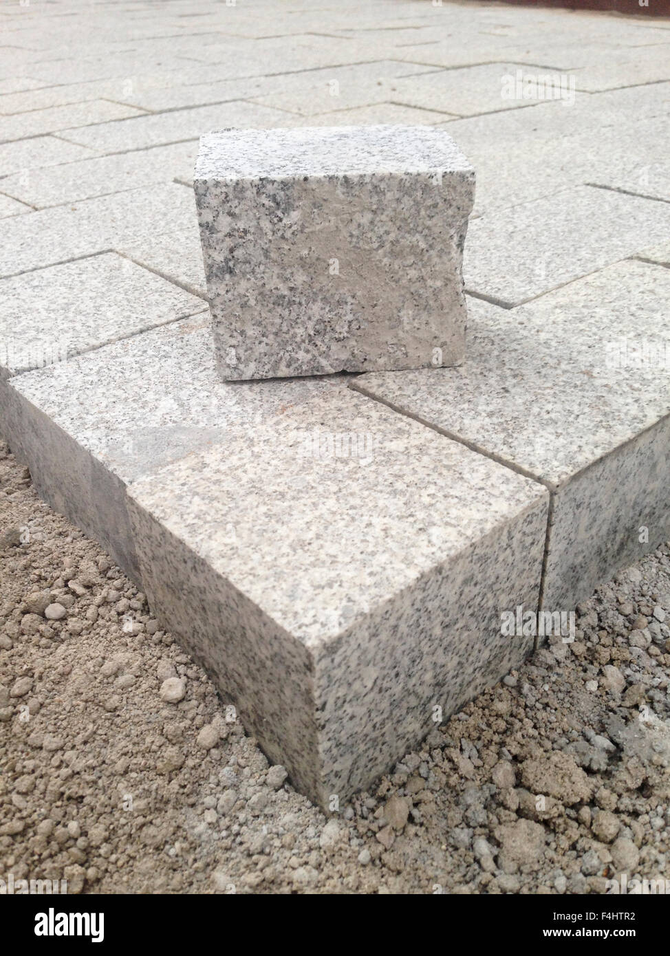 Cube granite brick for laying paving floor in construction site Stock ...