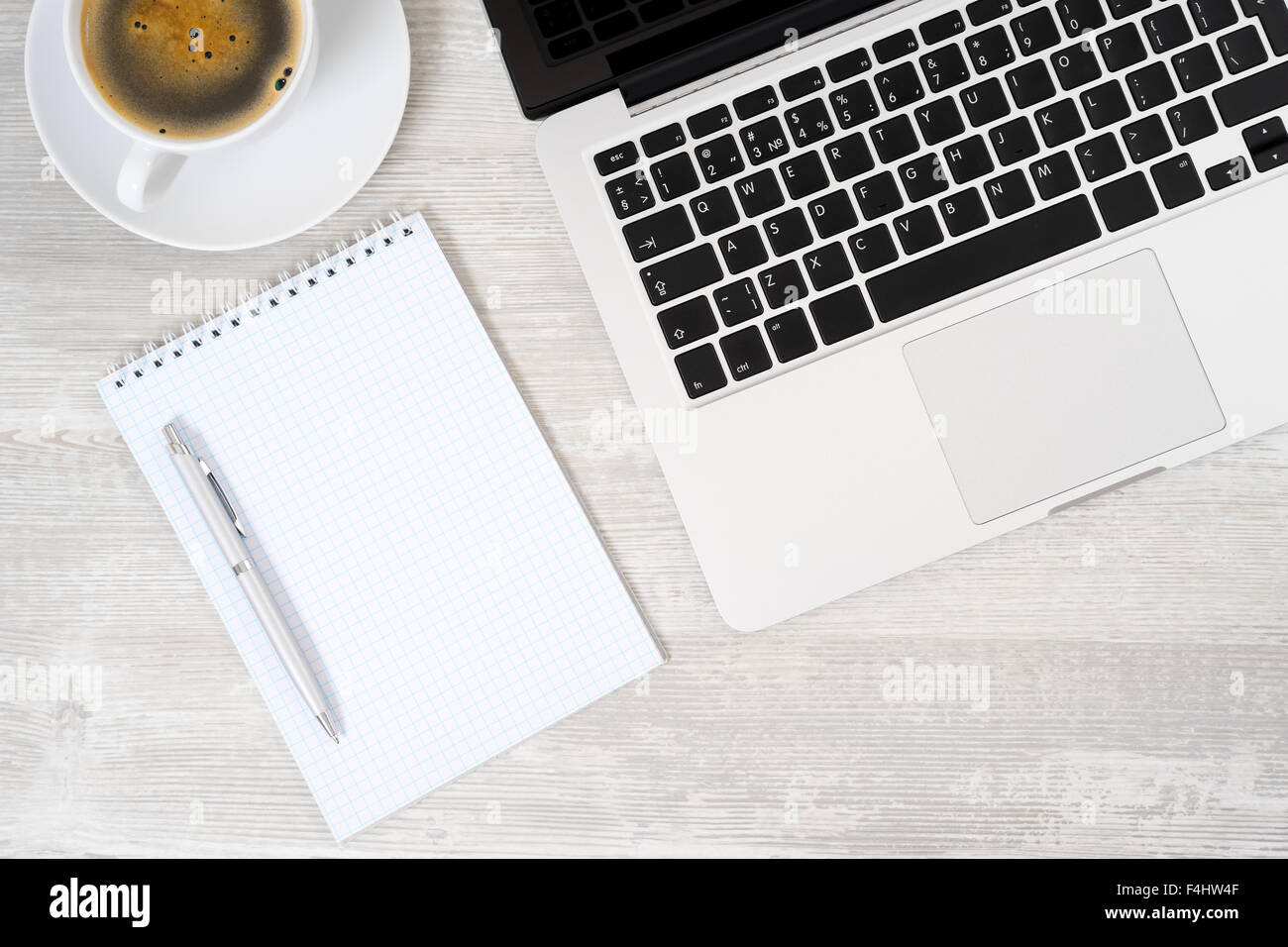 Laptop in the office and notepad, coffee Stock Photo - Alamy