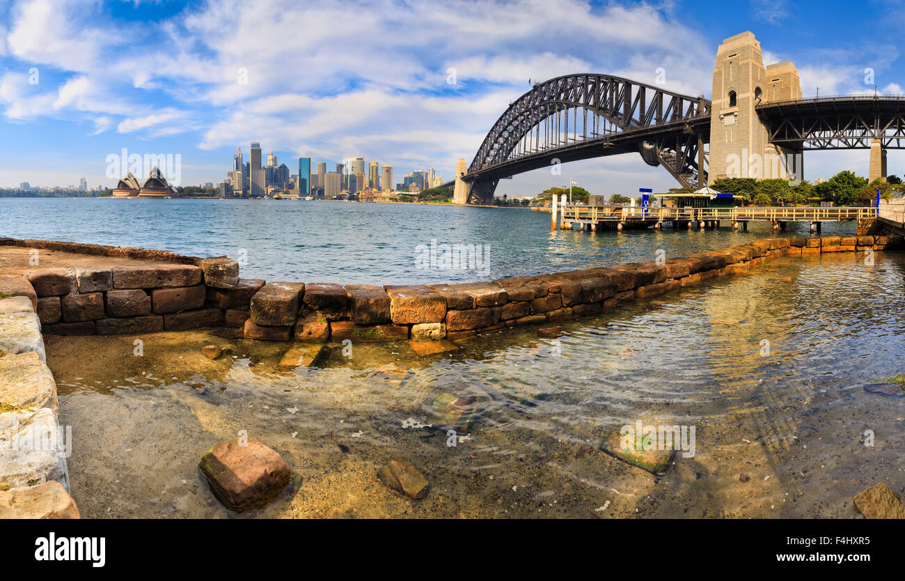 rock pool in Sydney harbour in a foreground of CBD view across water ...