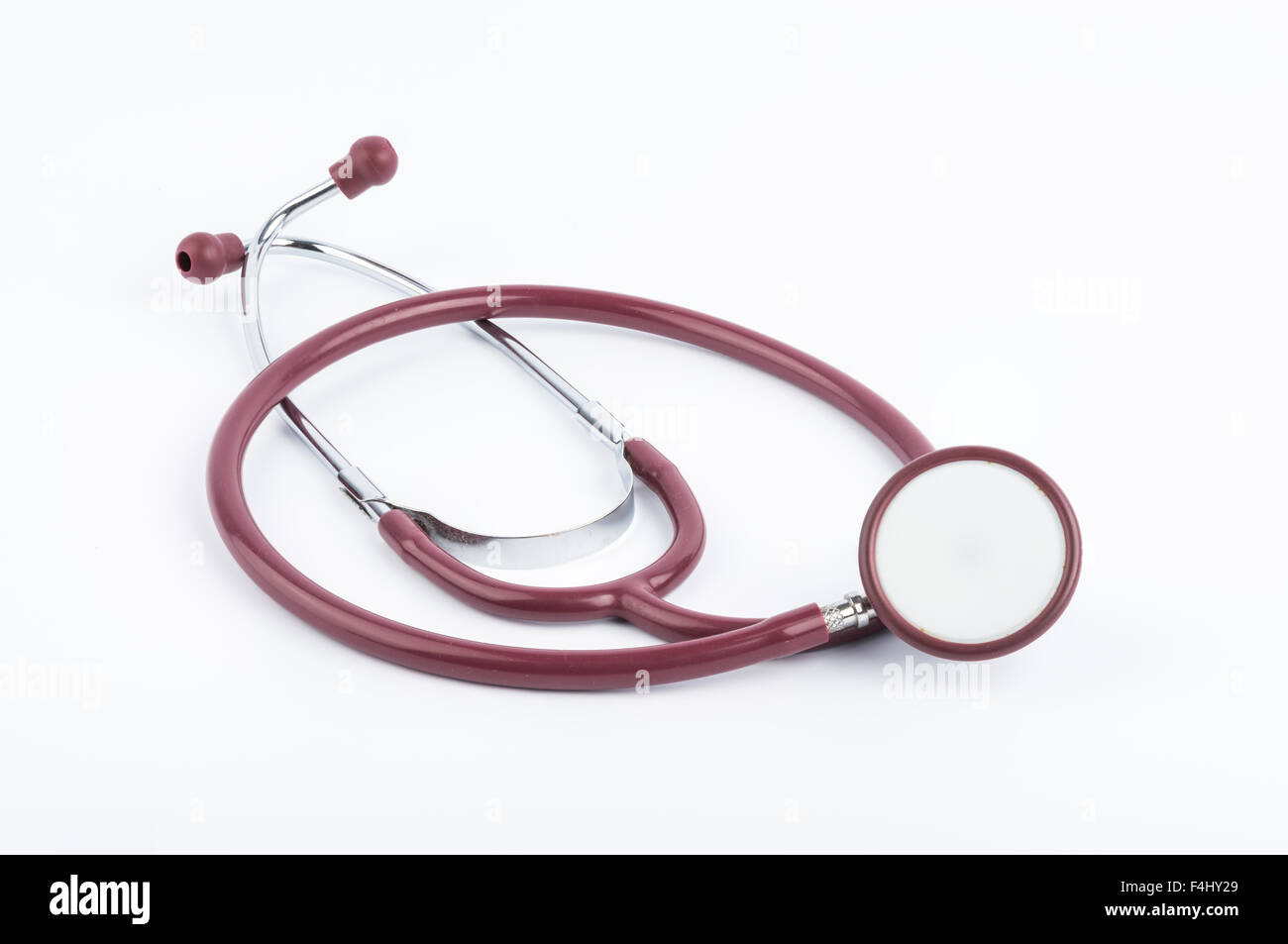 Red stethoscope medical equipment on white background Stock Photo - Alamy