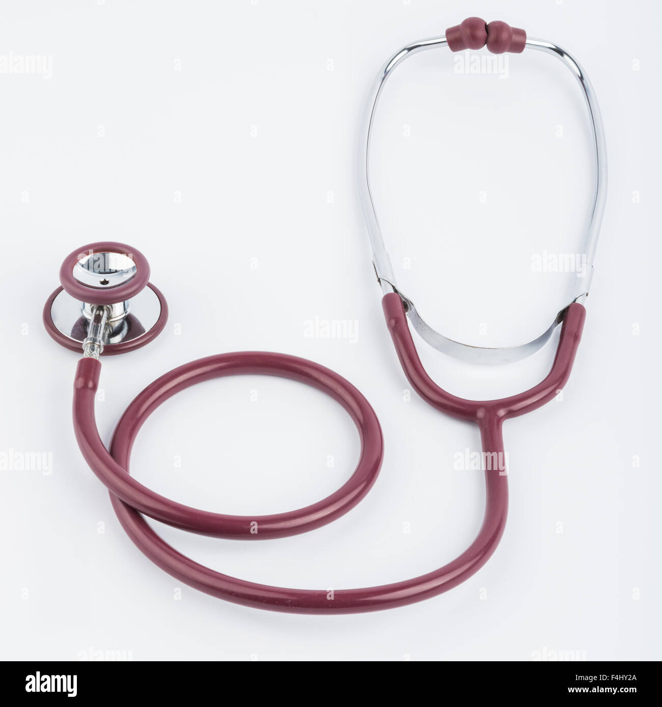 Red stethoscope medical equipment on white background Stock Photo - Alamy
