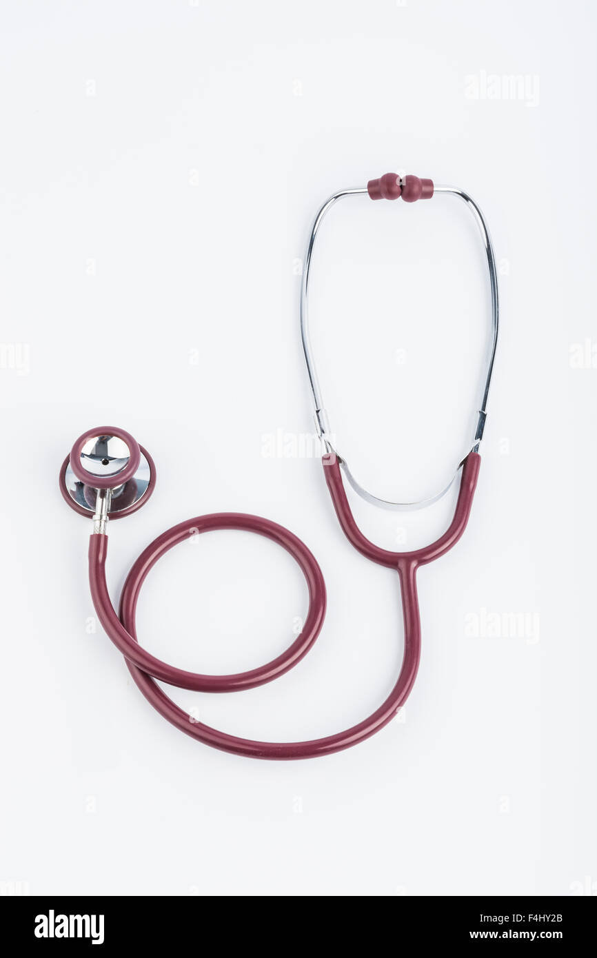 Red stethoscope medical equipment on white background Stock Photo - Alamy