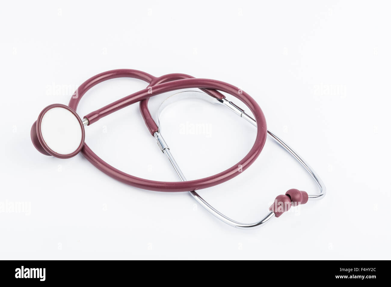 Red stethoscope medical equipment on white background Stock Photo - Alamy