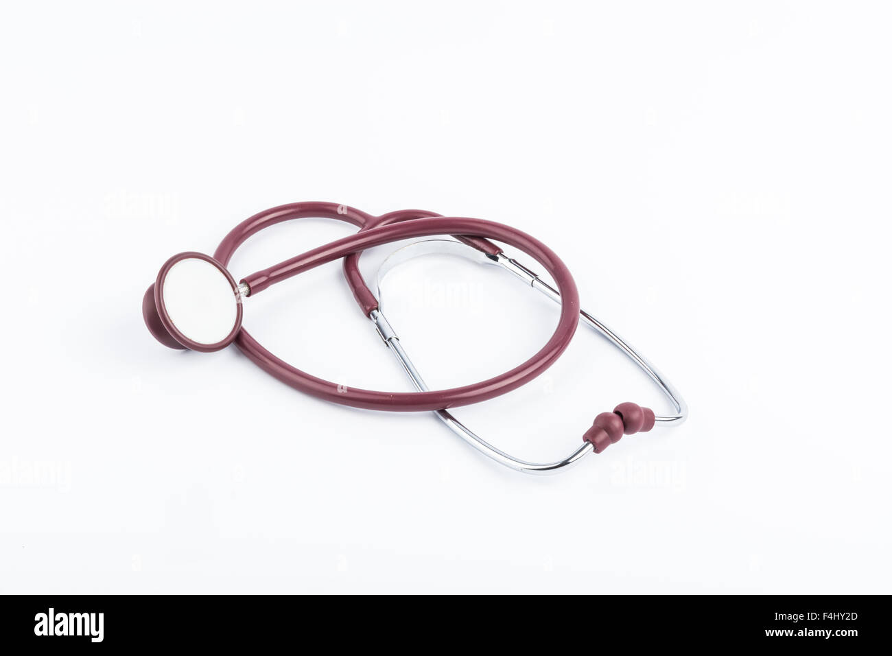 Red stethoscope medical equipment on white background Stock Photo - Alamy