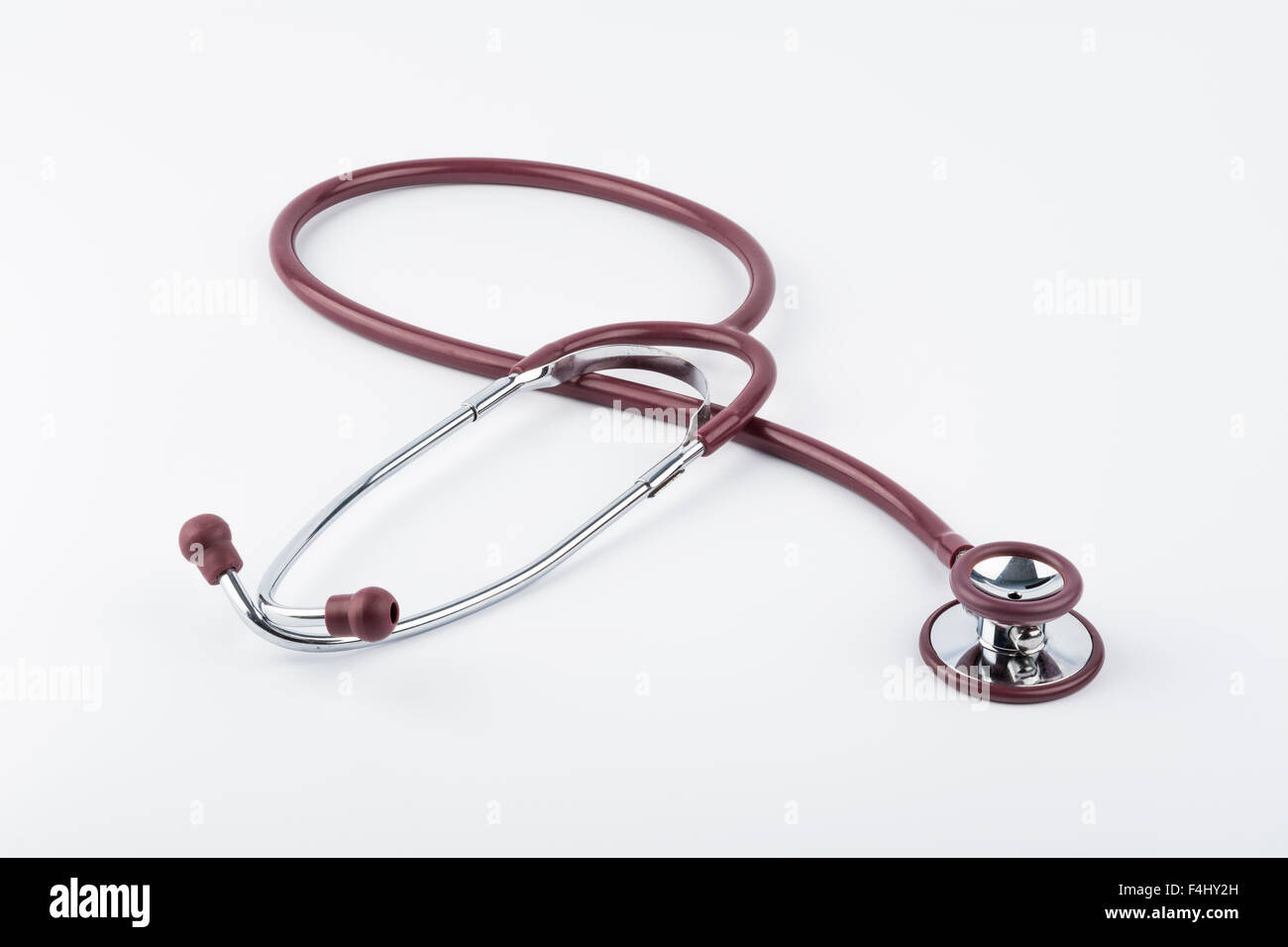 Red stethoscope medical equipment on white background Stock Photo - Alamy
