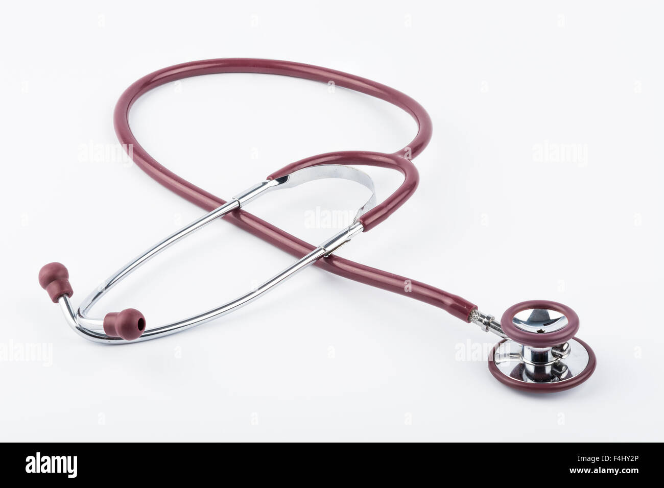 Red stethoscope medical equipment on white background Stock Photo - Alamy