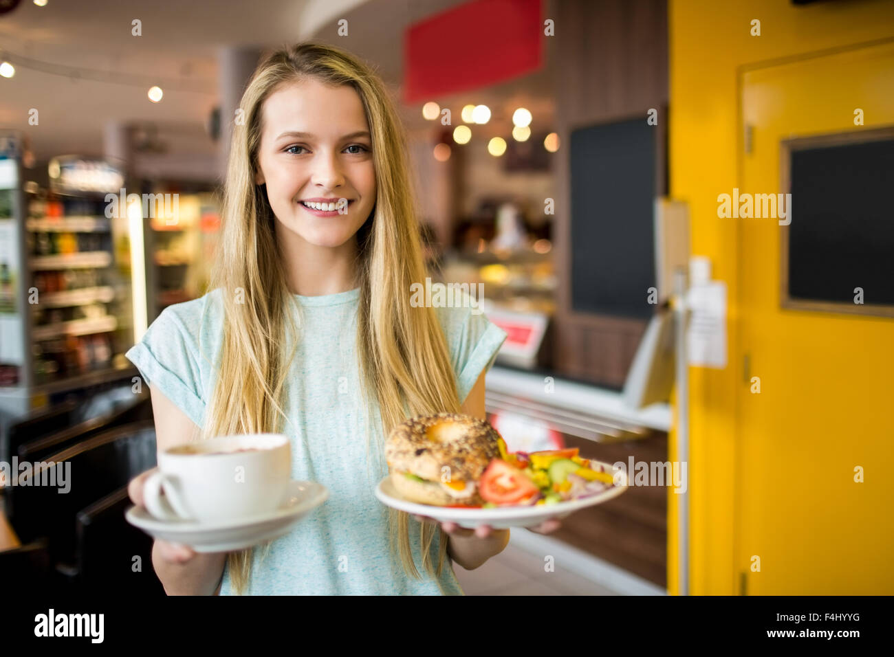 Pretty blonde with her lunch Stock Photo - Alamy