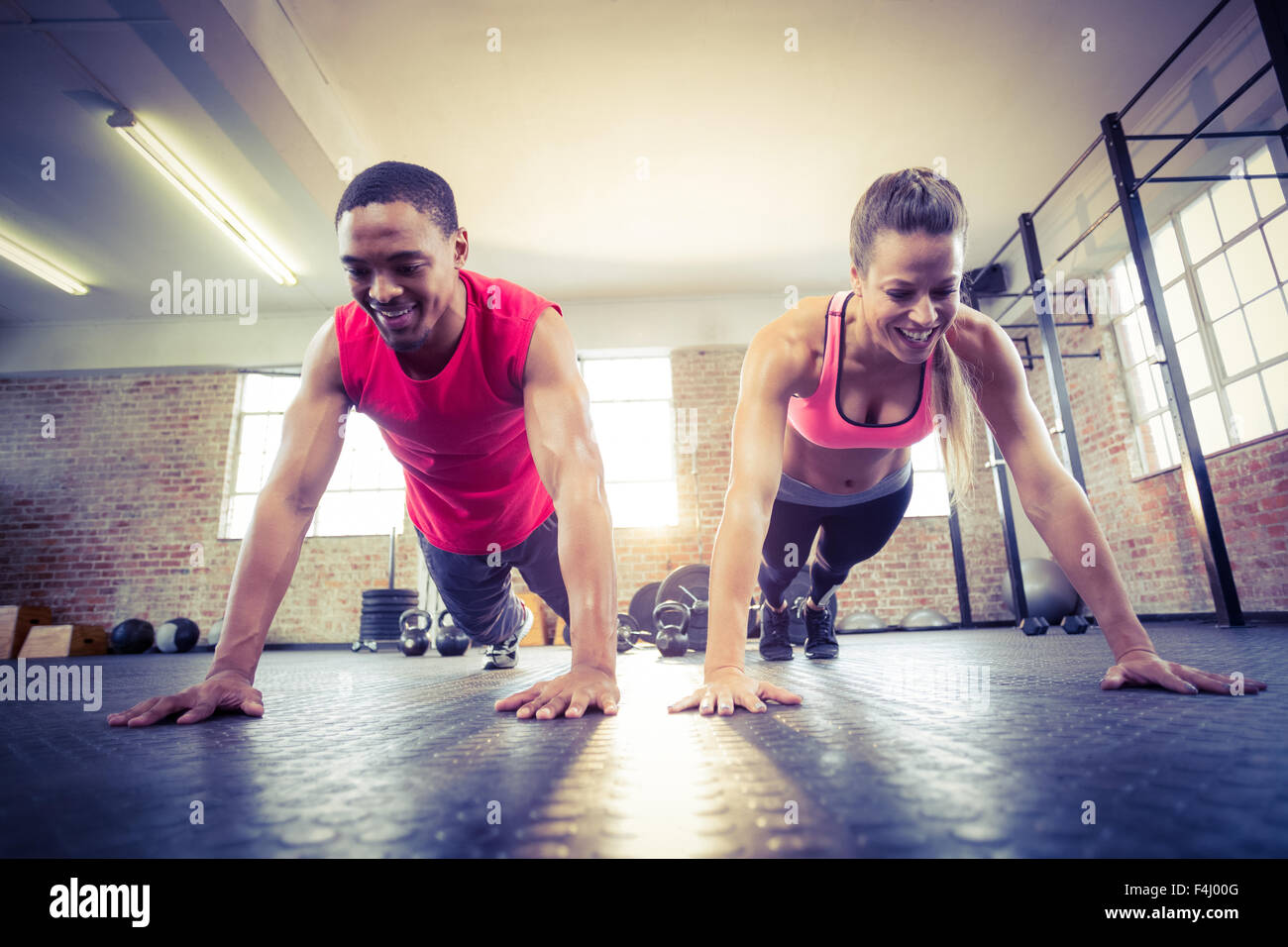 Fit couple doing push ups Stock Photo - Alamy