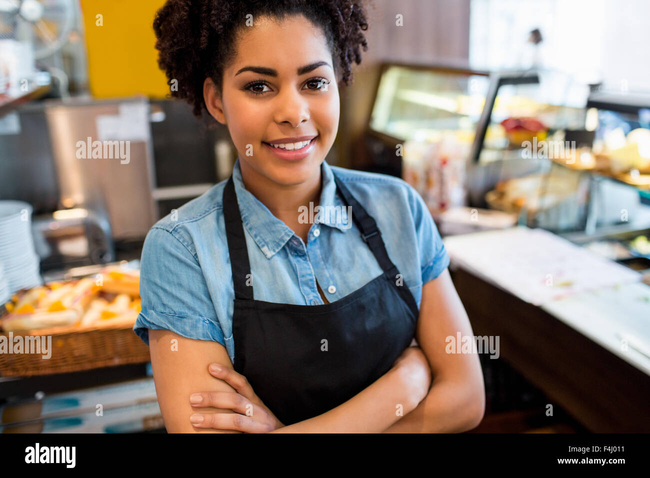 Pretty waitress smiling at camera Stock Photo - Alamy
