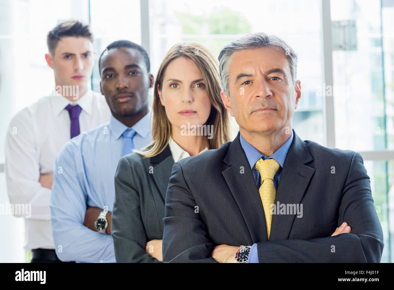 Business serious people posing together Stock Photo - Alamy