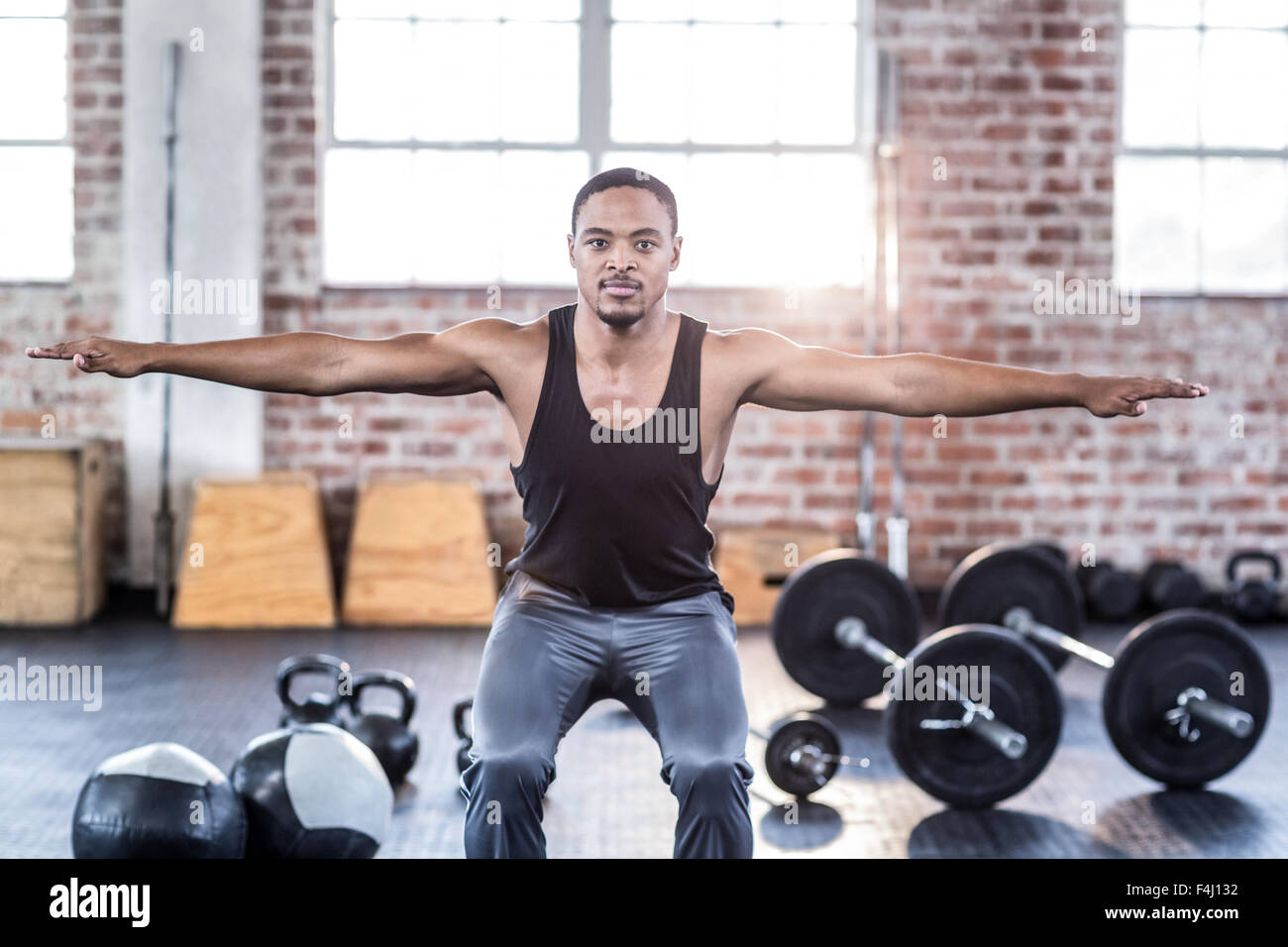 Muscular man doing stretching exercises Stock Photo - Alamy