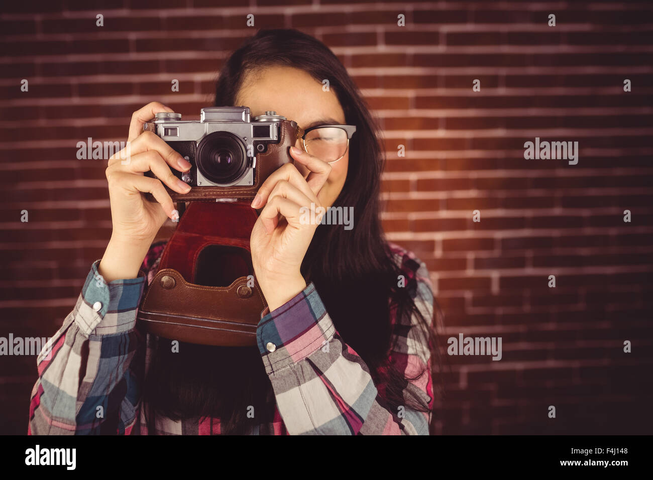 Attractive hipster photographing with camera Stock Photo - Alamy