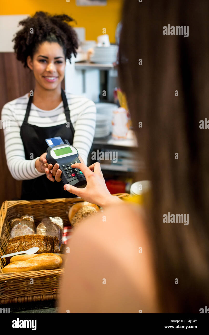 Customer paying with credit card Stock Photo - Alamy