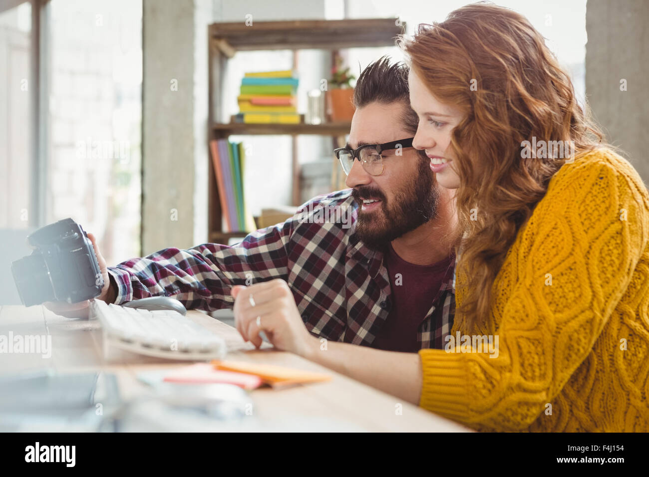 Man and woman looking at camera Stock Photo - Alamy