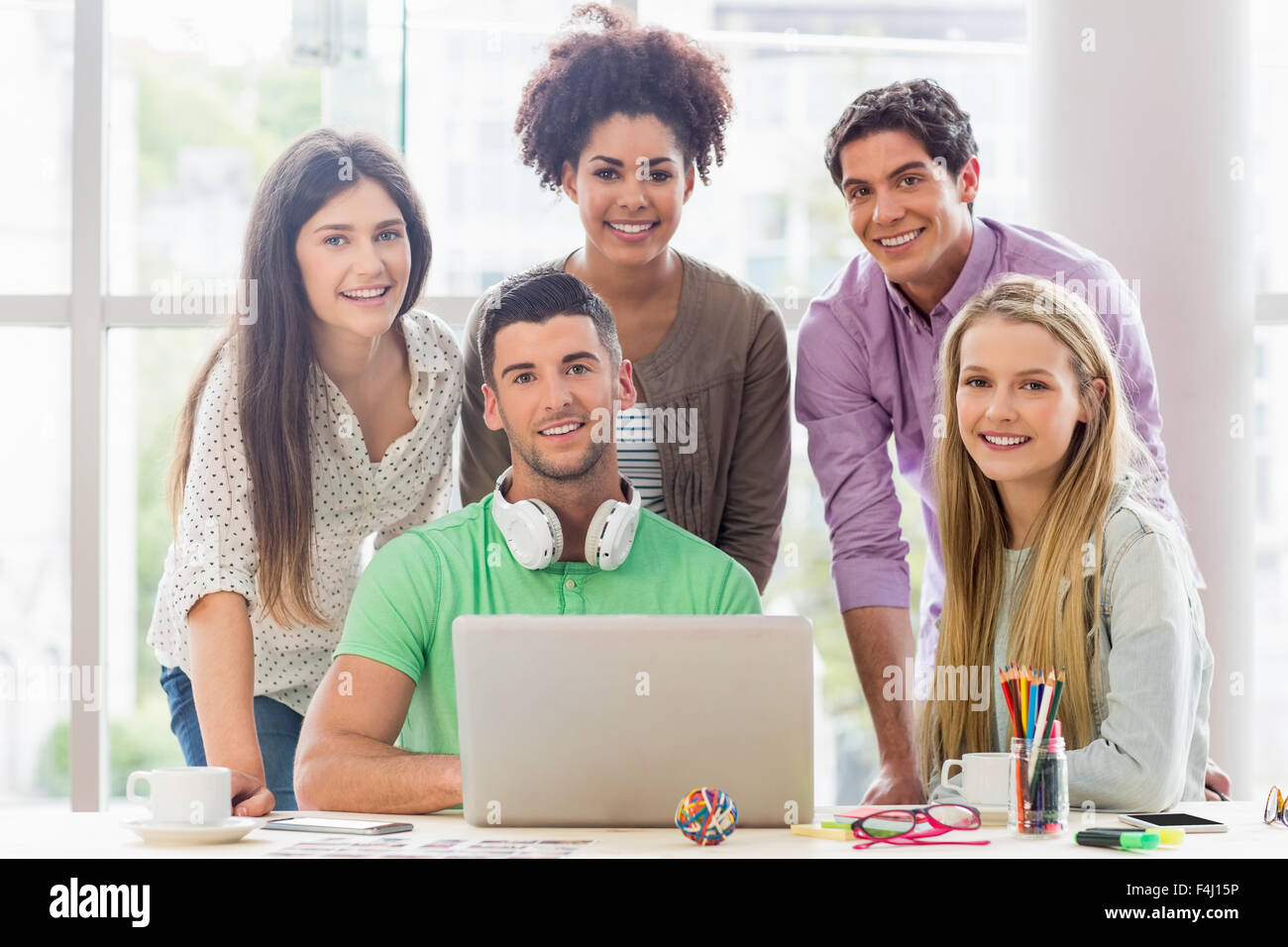 Students working together on laptop Stock Photo - Alamy
