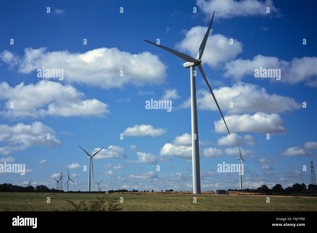 Wind farm large turbine on shore Stock Photo - Alamy