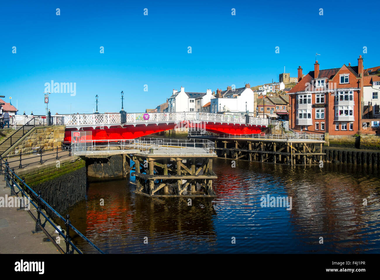 Whitby swing bridge brightly painted red viewed from the West side of ...