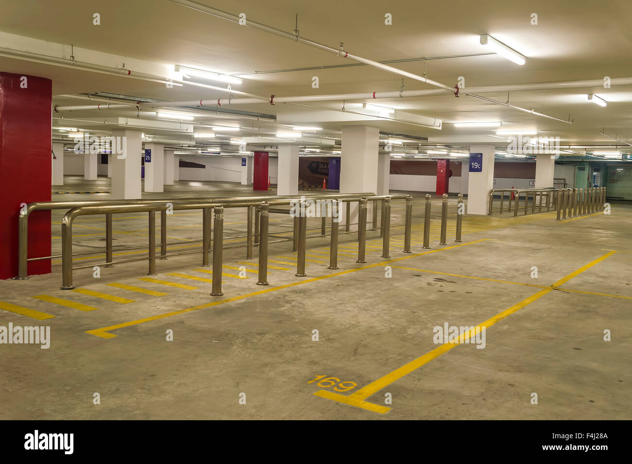 Empty parking lot inside commercial building Stock Photo - Alamy