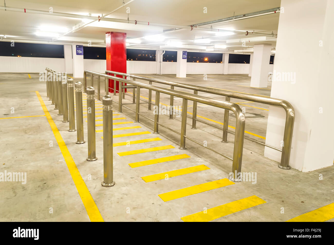 Empty parking lot inside commercial building Stock Photo - Alamy