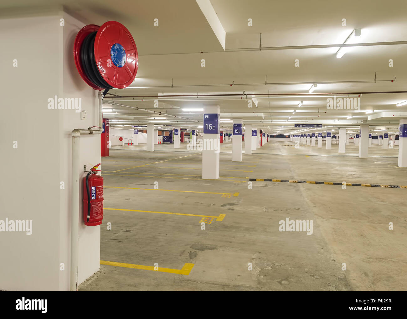 Empty parking lot inside commercial building Stock Photo - Alamy
