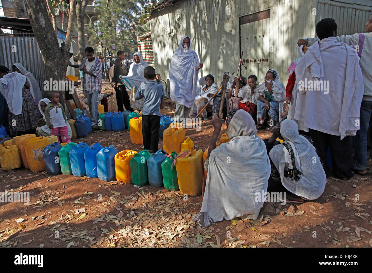 Women queue for water with plastic cans in the outskirts of Addis Ababa ...