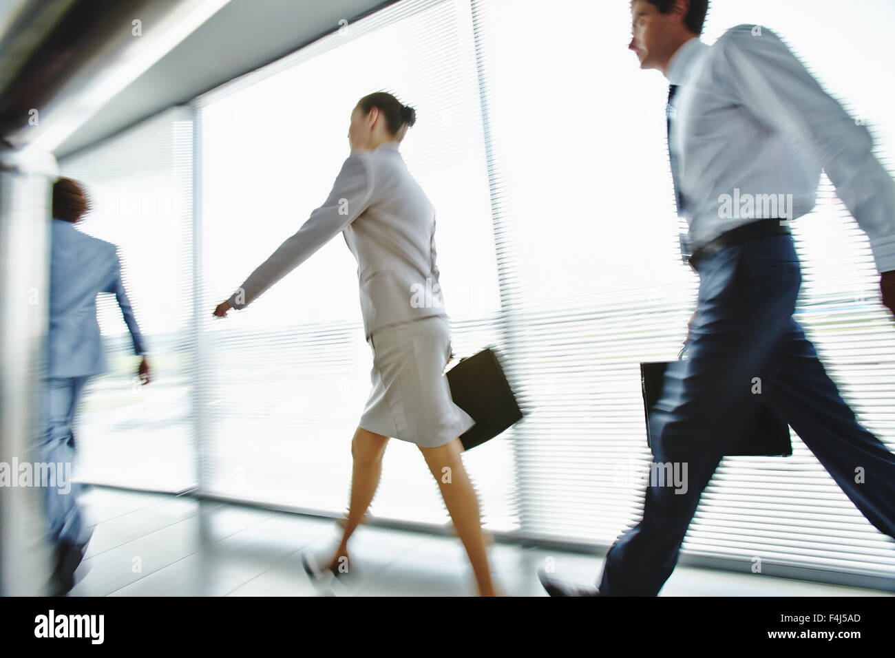 Busy employees moving for work in the morning Stock Photo - Alamy