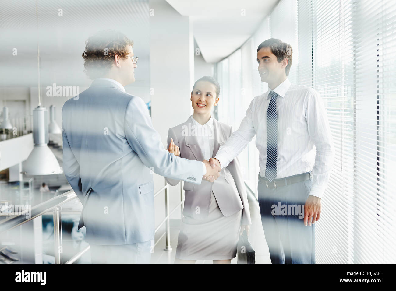 Group of employees talking at meeting in office Stock Photo - Alamy