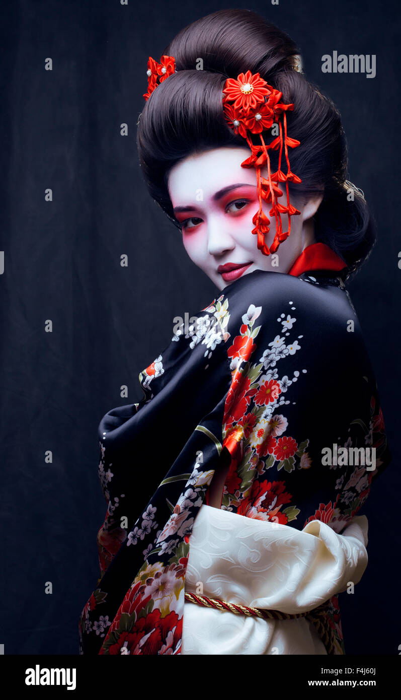 young pretty geisha in kimono with sakura and decoration Stock Photo ...