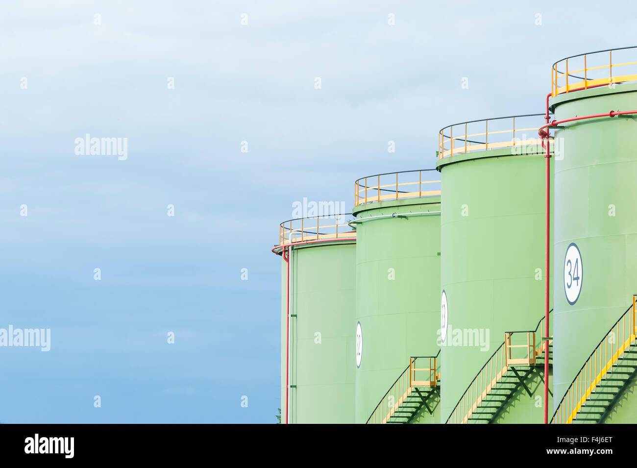 Industrial Storage Tanks. Oil tanks in line Stock Photo - Alamy