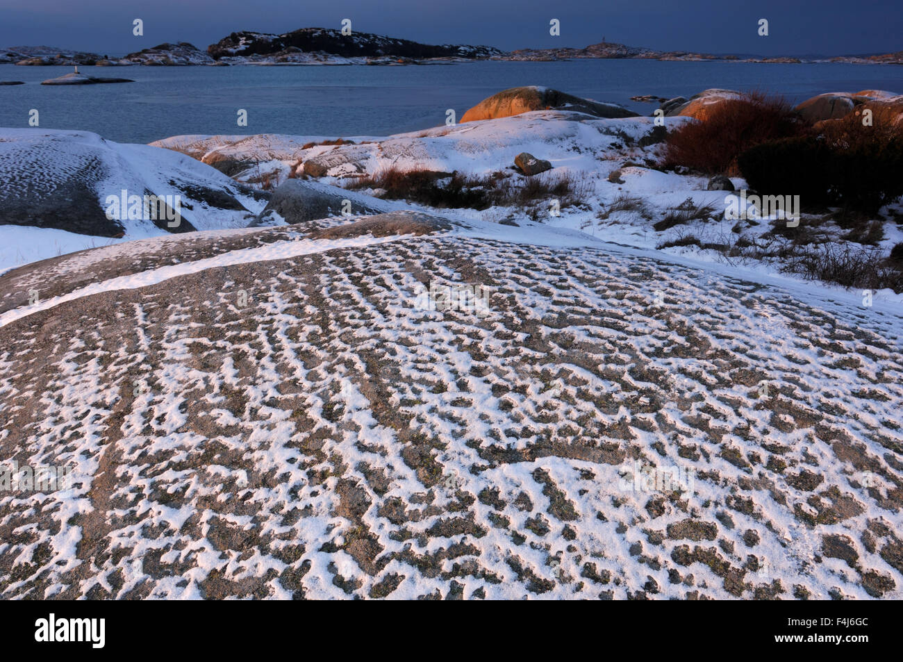 Snow on a flat rock Stock Photo - Alamy