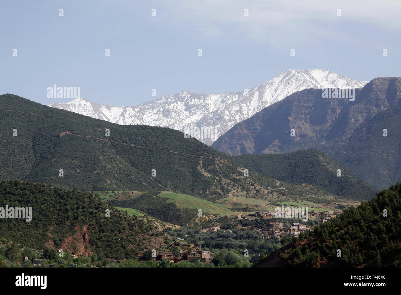 Snow-capped High Atlas mountains overlooking the Ourika Valley to the ...