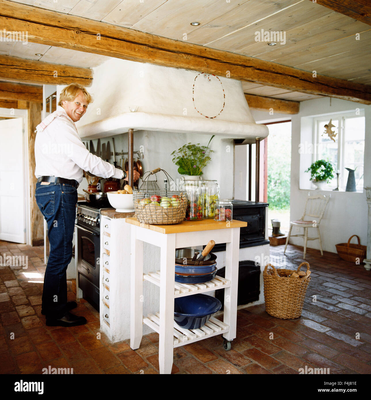 A man in a kitchen Stock Photo - Alamy