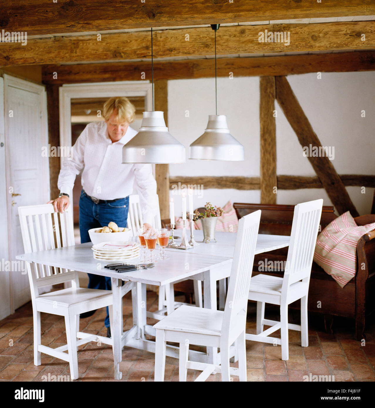 A man setting the table Stock Photo - Alamy