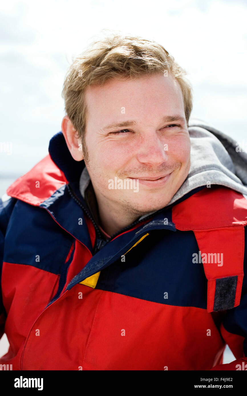 Portrait of a smiling man sailing, Sweden Stock Photo - Alamy