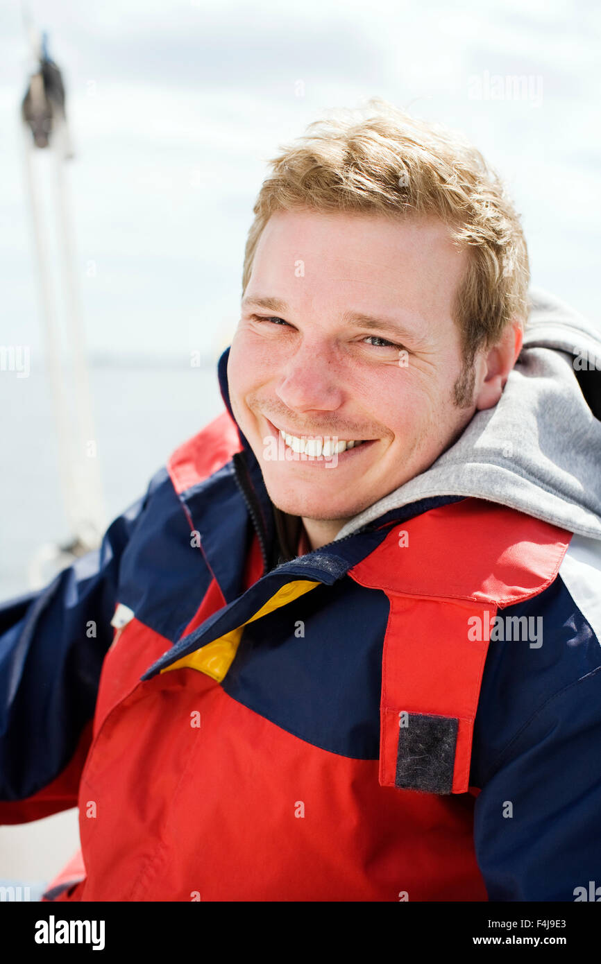 Portrait of a smiling man sailing, Sweden Stock Photo - Alamy