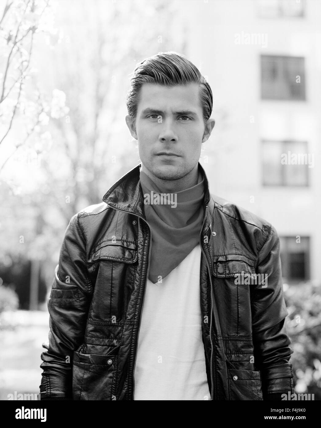 Portrait of a man wearing a leather jacket Stock Photo - Alamy