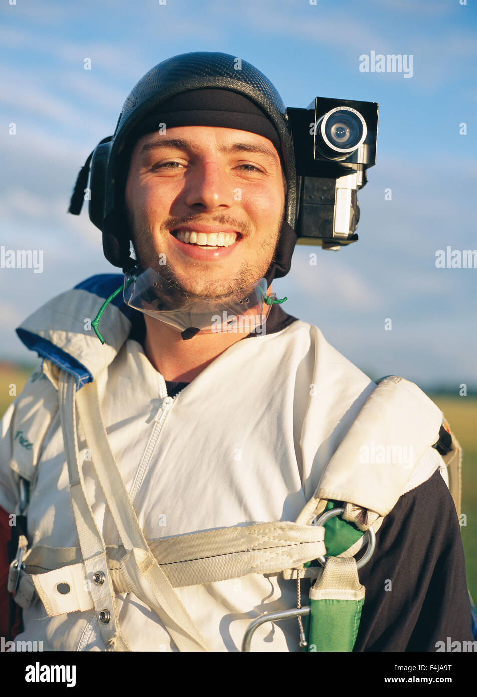 Parachute jumper with a camera Stock Photo - Alamy