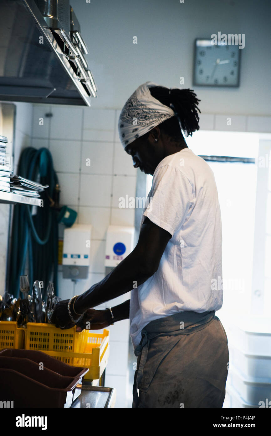 Man washing up restaurant hi-res stock photography and images - Alamy