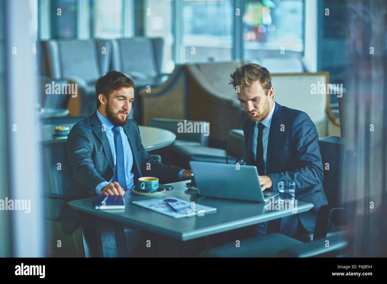 Young employees working upon project in office Stock Photo - Alamy