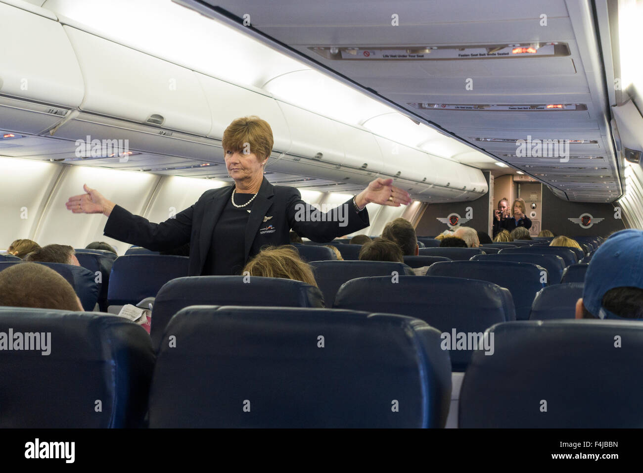 flight crew attendant giving safety instructions Stock Photo - Alamy
