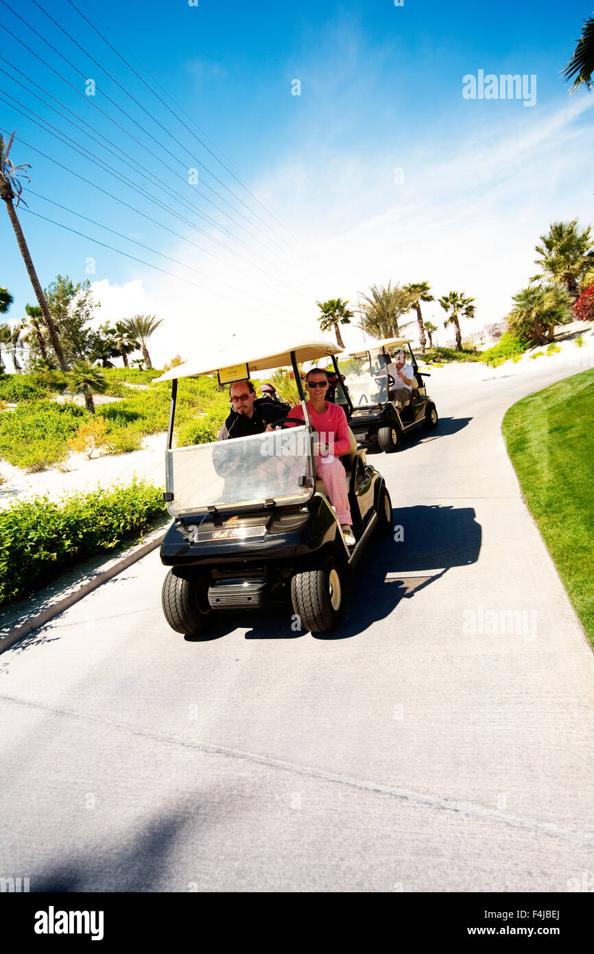 Men in golf carts, USA Stock Photo - Alamy
