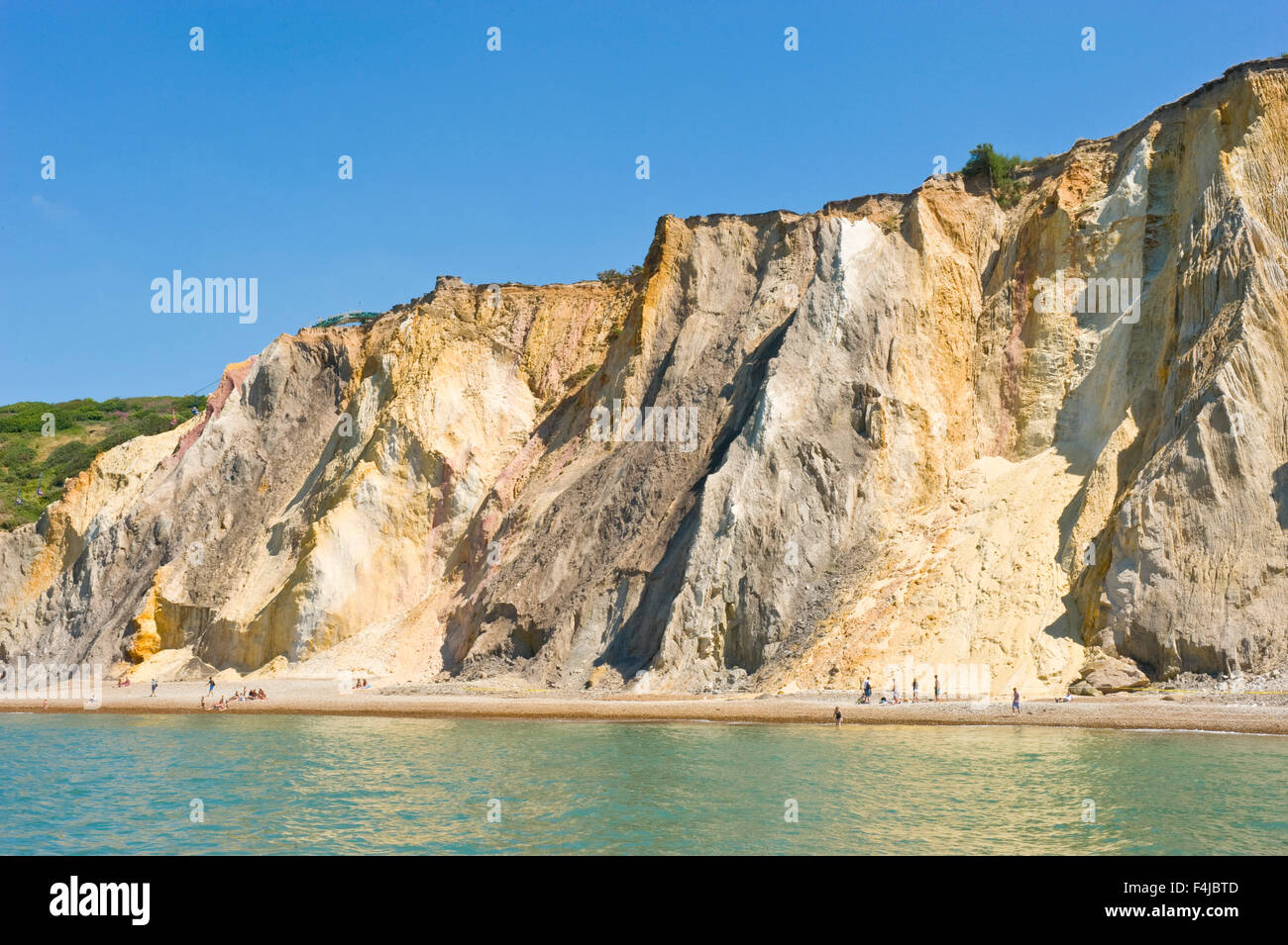 A view of the multi-coloured sand cliffs at Alum Bay beach on the Isle ...