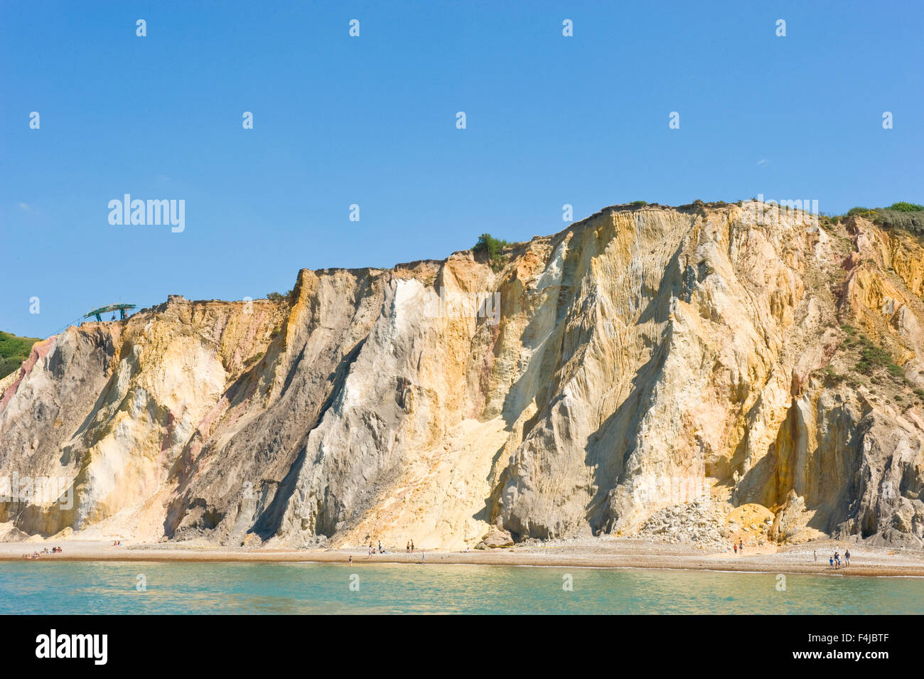 A view of the multi-coloured sand cliffs at Alum Bay beach on the Isle ...